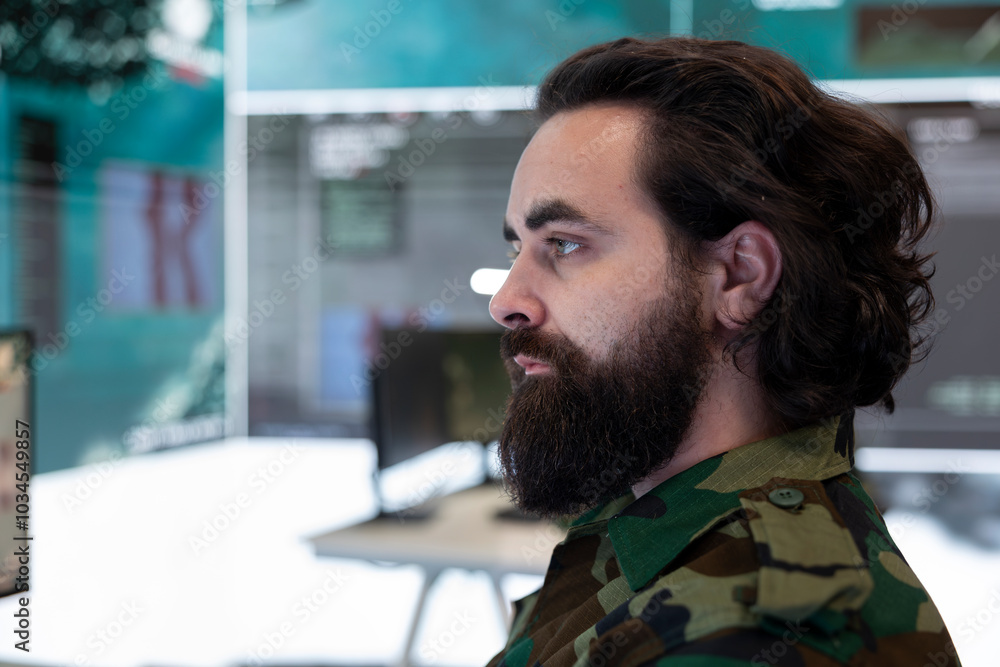 Major army officer studying surveillance satellite system on a world ...