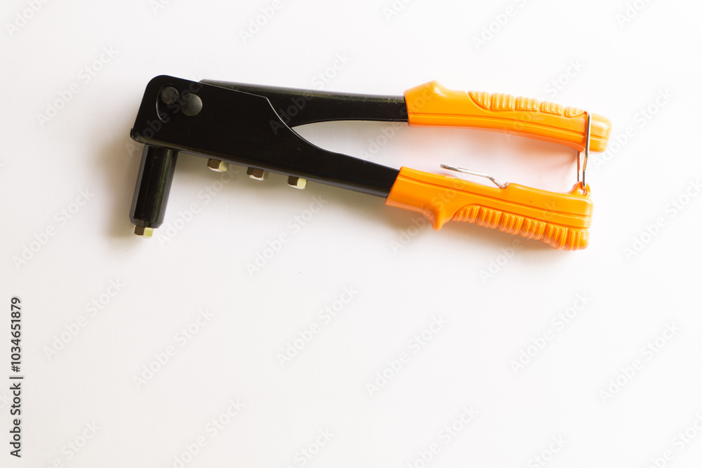 Rivet tool with orange handle and silver blind rivets for hand rivets ...