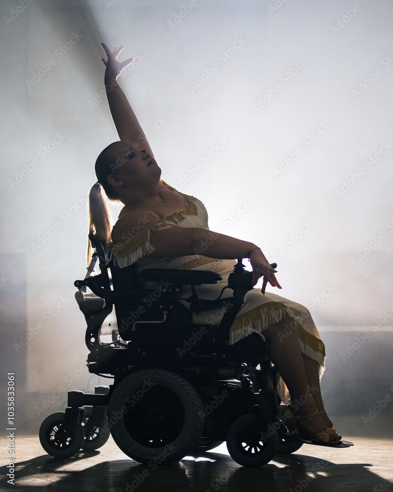 Woman practicing and performing a freestyle wheelchair dance at a ...
