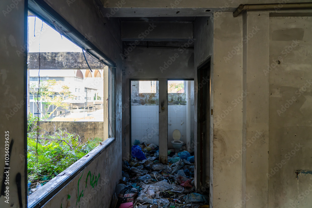 Toilets and bathroom in abandoned apartment building completely filled ...