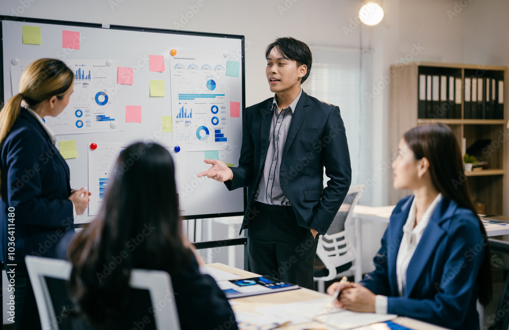 Businessman is giving a presentation to his colleagues in a modern ...