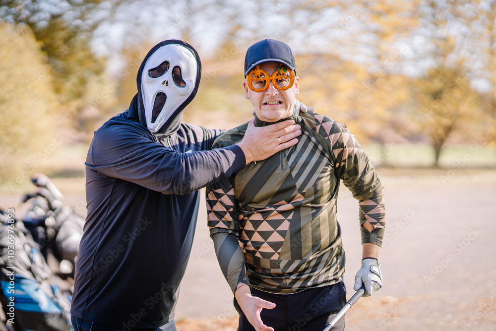 Two men in Halloween costumes on a golf course, one wearing a Ghostface ...