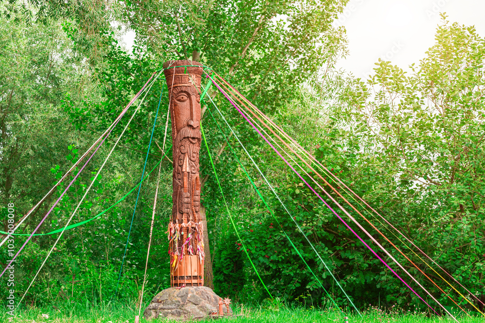 spring ritual pagan symbol statue wooden carved pillar May month bright ...