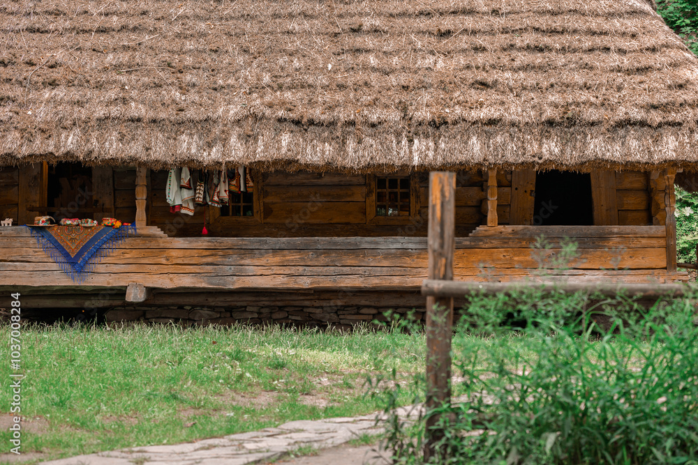 Ukrainian traditional wooden house with hay and cane roof rural ...