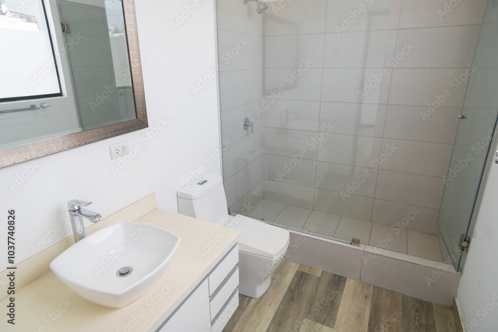 Poster baño de departamento con acabados de loza , lavabo inodoro y ...