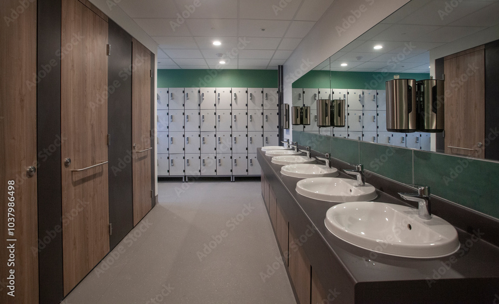 Modern public restroom with bespoke unit with sinks Stock Photo | Adobe ...
