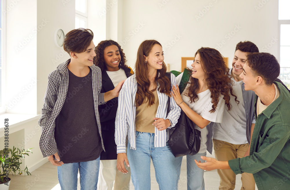 New student gets a warm welcome at the new school. Group of friendly ...