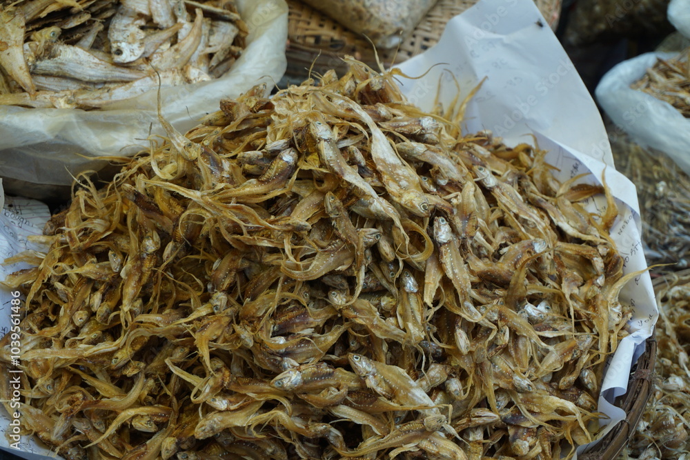 Mixed dried fish are displayed and sold at a fish market, Different ...