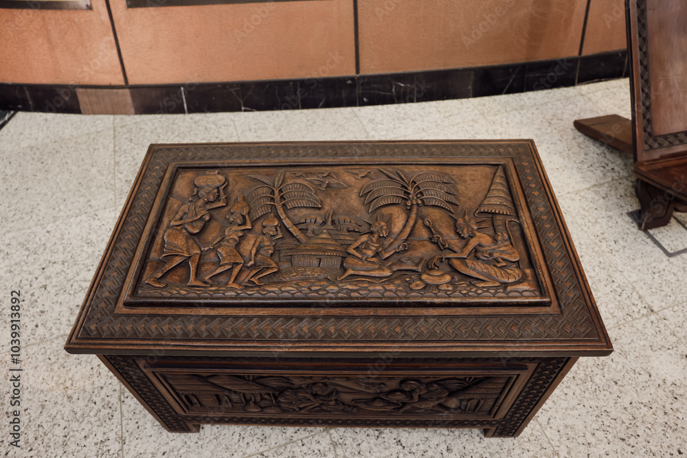 Luanda, Angola - May 17, 2024: Carved wooden chest at the Memorial of ...