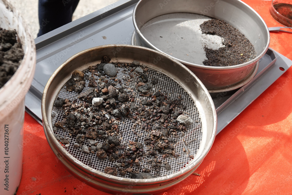 objects illustrating the process of archaeological excavations, bucket ...