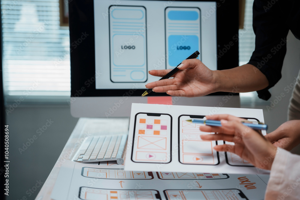 Web Designers Discussing About User Experience Ux And User Interface Ui Design For Mobile App On