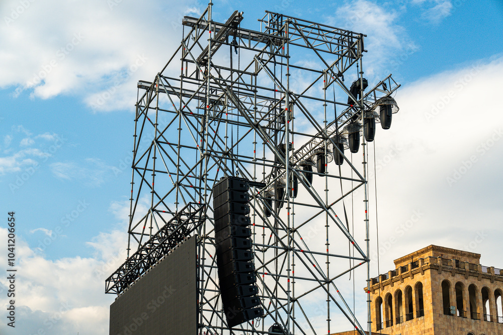 Overhead stage rigging equipment Concert stage with outdoor lighting ...