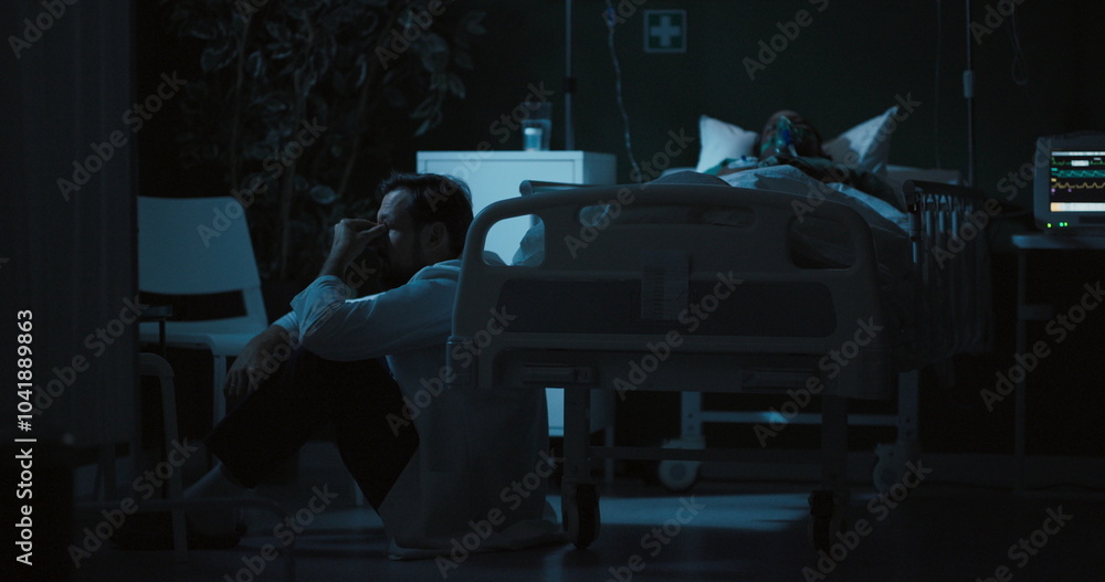 Doctor sits for hours on floor with legs bent next to seriously wounded ...