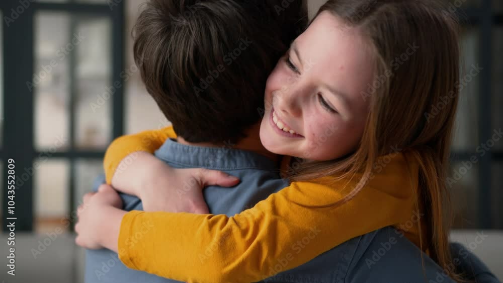 Happy cheerful Caucasian little child girl daughter hugging cuddling ...