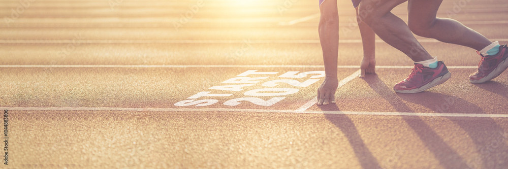 Male runner prepares to run on a treadmill. With text starting the year ...