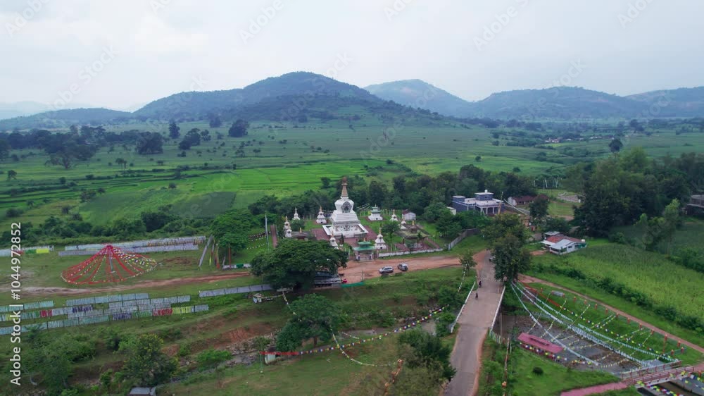 Aerial view of Jiranga Buddhist Monastery, set in a green valley ...