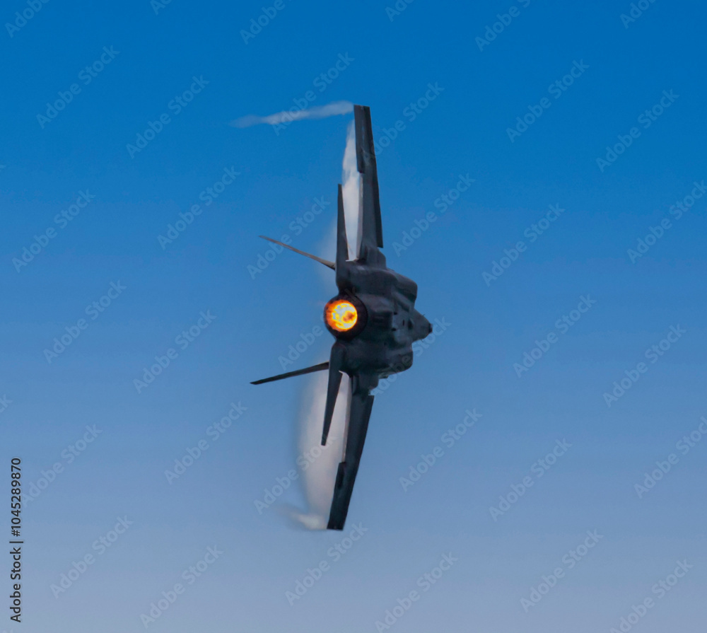 F-35 Lightning II Fighter Jet Flying Against a Blue Sky With Clouds ...