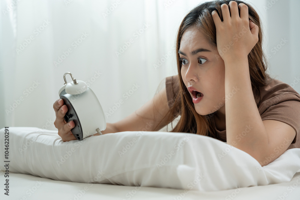 Shocked Asia young woman looking at clock alarm, lady is late ...