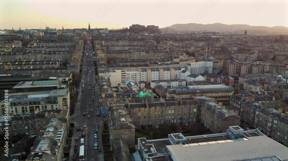 Slow-motion clip of Edinburgh at sunset, featuring streets lined with ...