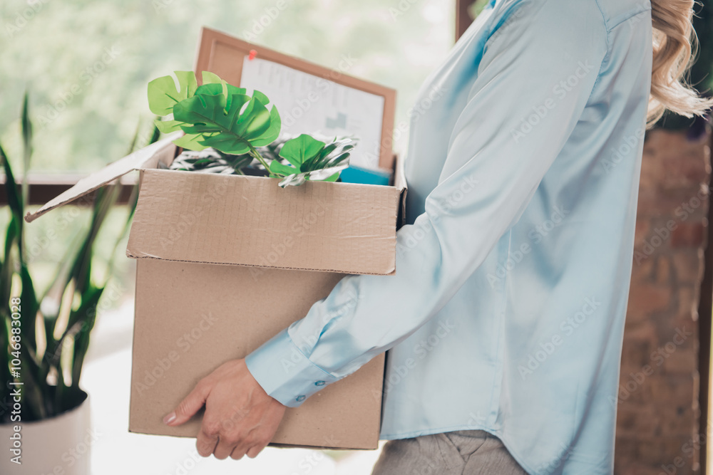 Cropped profile portrait of young business woman hold belongings box ...