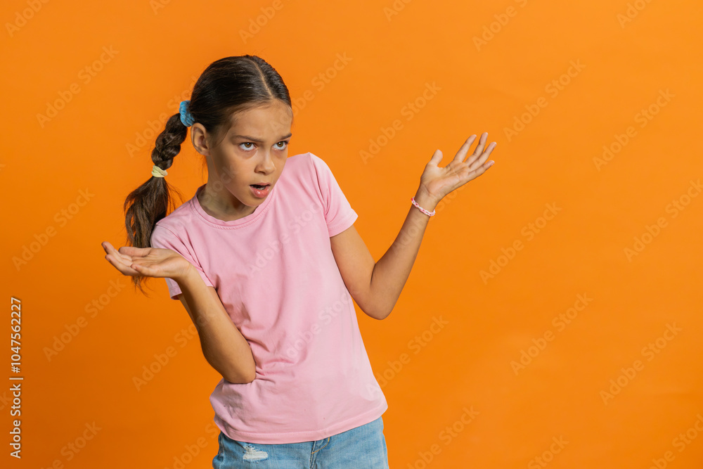 What. Why. Young school girl raising hands in indignant expression ...