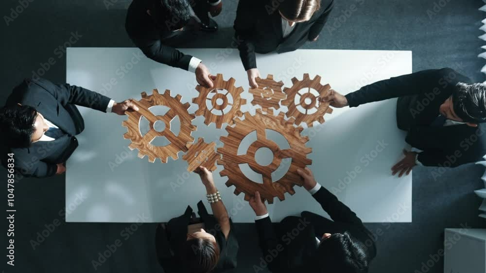 Top view of professional business team bring filled last cog to ...