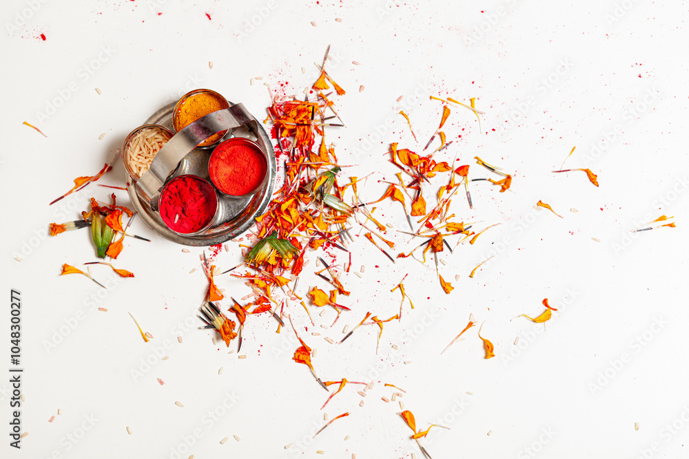 Indian traditional pooja background. Flower petals and rice are spread ...