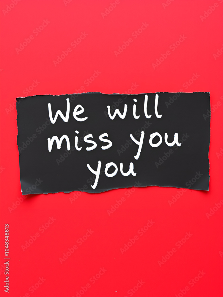 We will miss you message written on ripped black paper piece with red background. Conceptual we ...