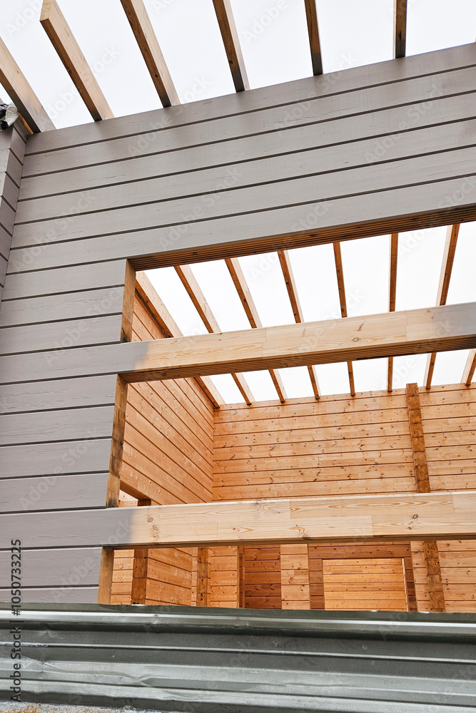 Multi-story wooden home in building progress creating a sustainable ...