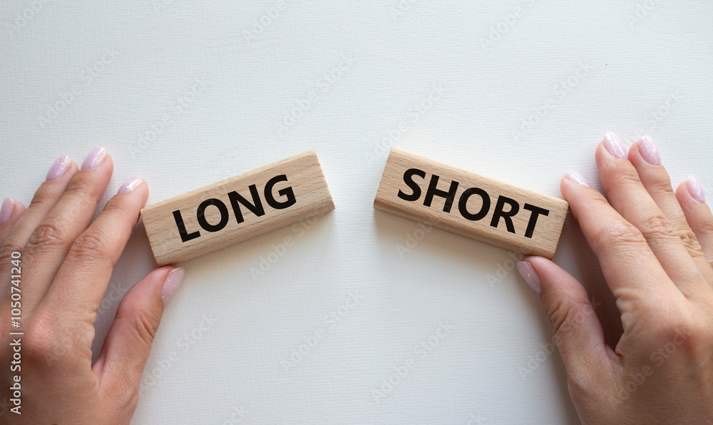 Short vs Long symbol. Concept word Short vs Long on wooden blocks ...