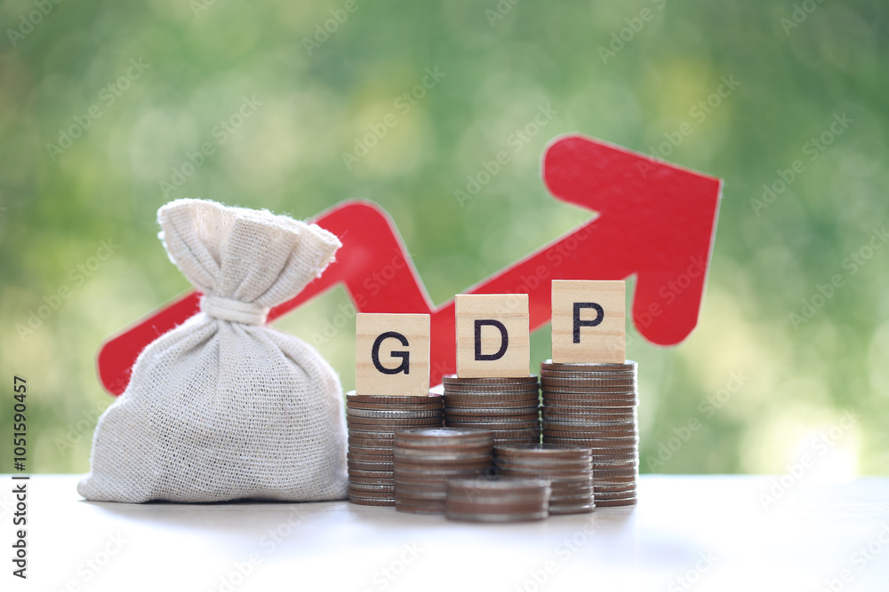 Red arrow on coins money and gdp word on natural green background, GDP (Gross Domestic Product ...