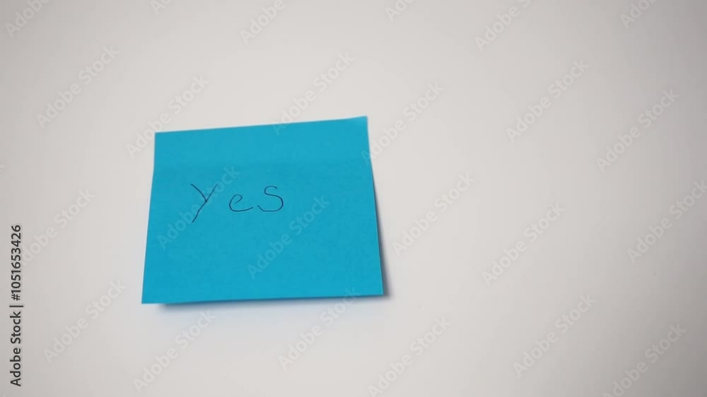 placing a blue sticky note with the word yes and a yellow sticky note ...