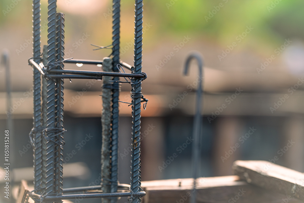 Concrete footings and reinforcing steel rods at a construction site ...