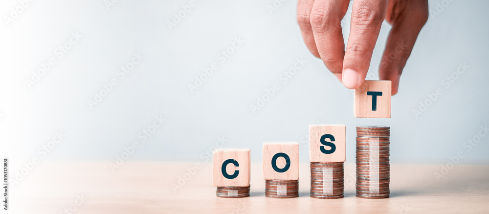 Cost reduction concept. Cost wording on decreasing coins stacking. cost ...