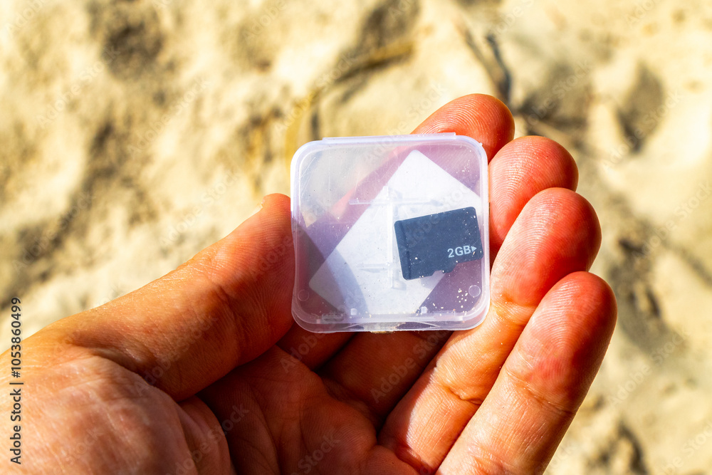 Small memory card in the box in your hand in Mexico. Stock Photo ...