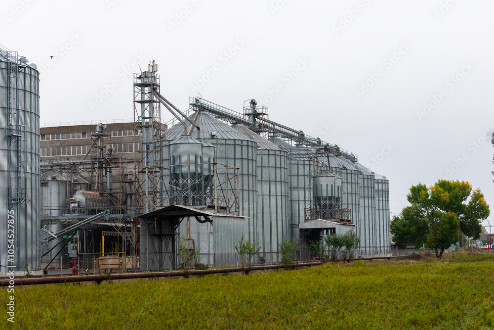 Grain processing plant. Large silos on the territory of the plant ...