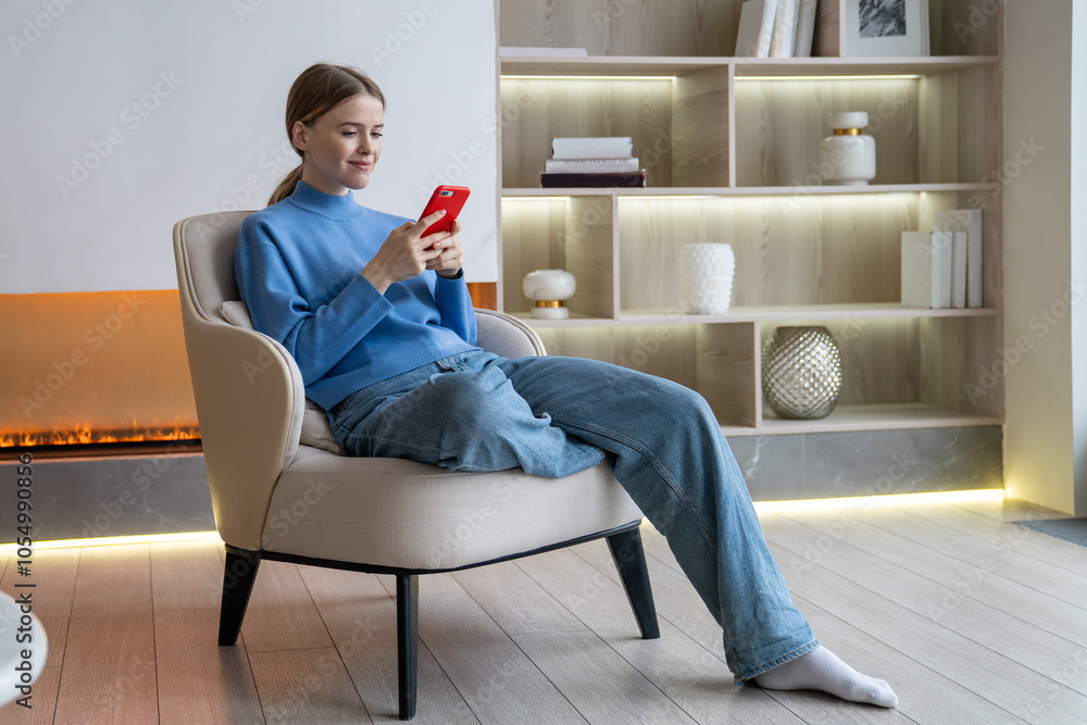 Pleasantly smiling positive middle-aged woman sitting on armchair in ...