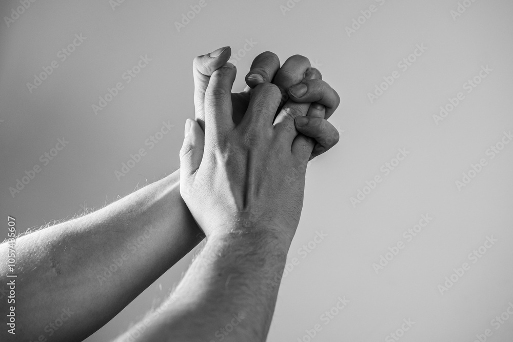 Two human hands making delicate and expressive gestures against a plain ...