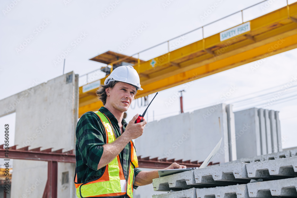 Professional engineer Caucasian male working in concrete precast plant ...