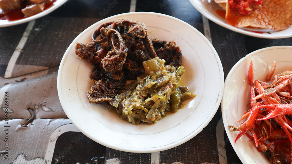 belut goreng. indonesian food from eel fish served with sambal hijau ...