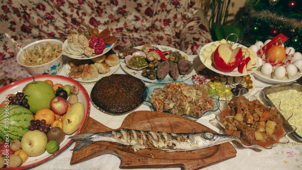 A table for Media Noche or New Year eve feast with diverse traditional ...