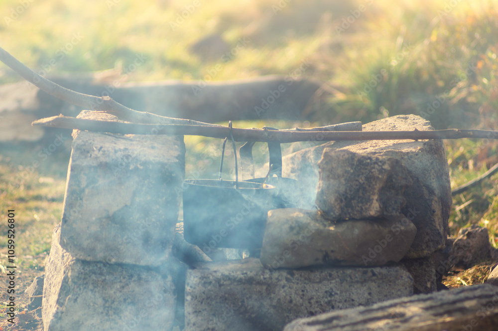 Improvised hearth made of cinder blocks. A tourist breakfast is boiled ...
