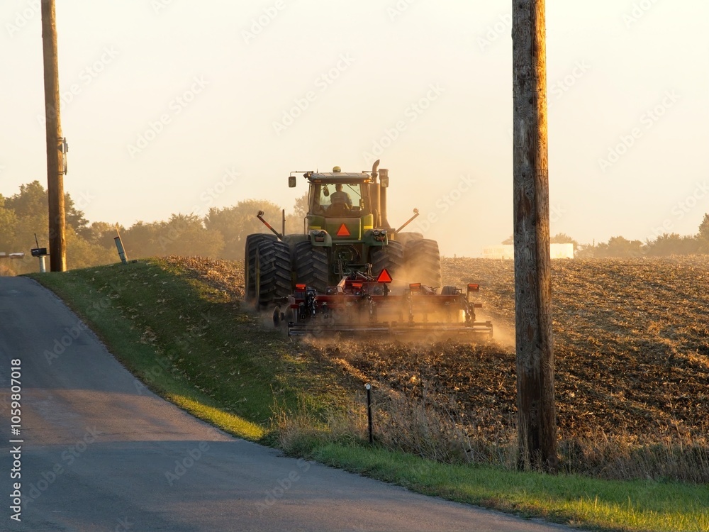 Poster Farmer disking corn field with farm implements – Wall Art ...