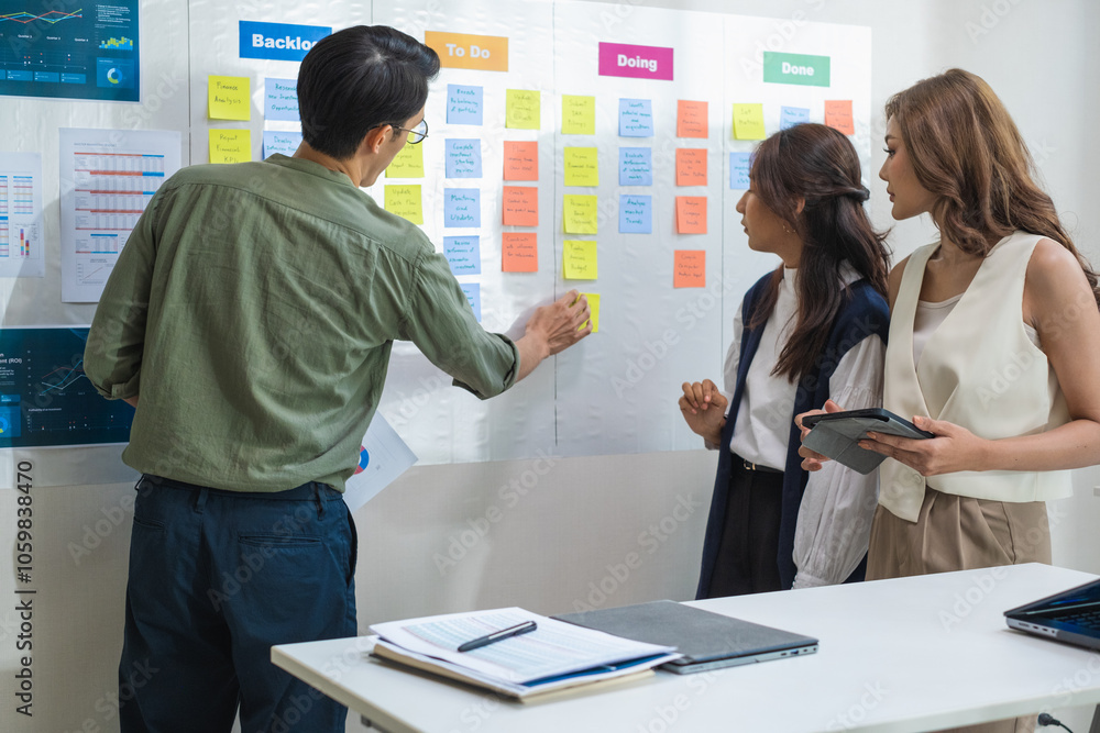 Poster brainstorming session, using sticky notes on a task board ...