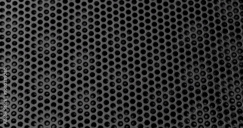Black Perforated Surface Texture. Close-up view of a black perforated ...