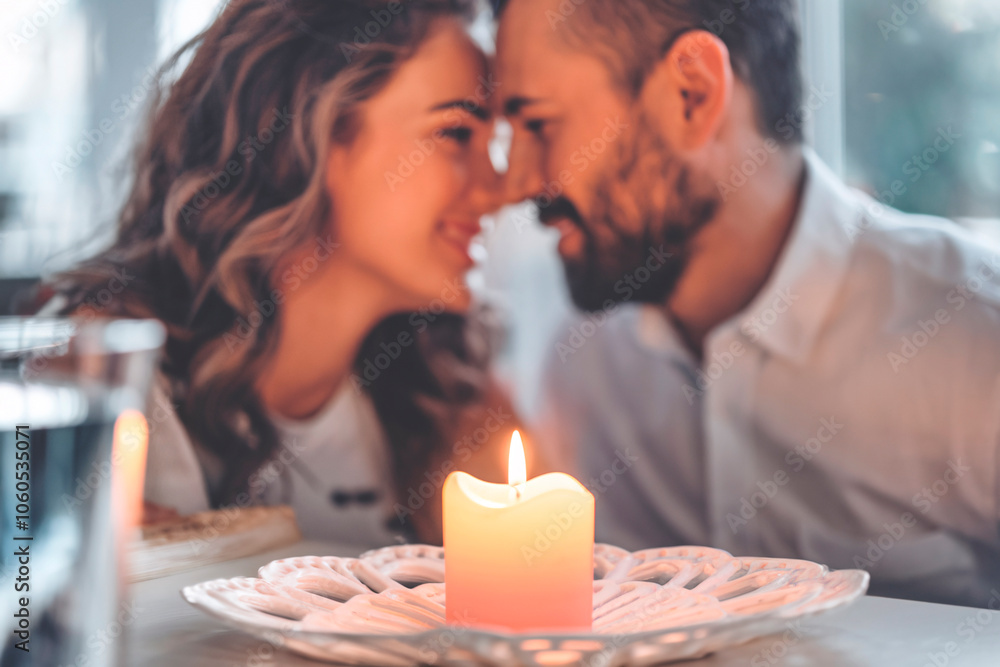 Romantic Candlelit Moment. A couple shares a romantic dinner, their ...