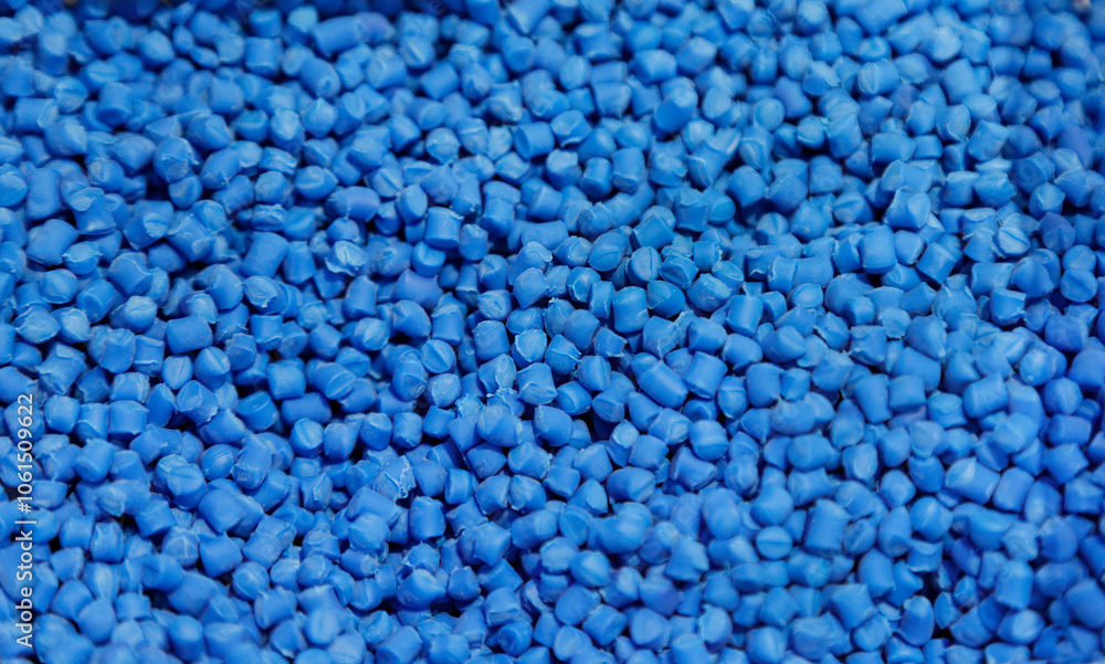The pile of blue pellets materials for plastic injection process. The ...