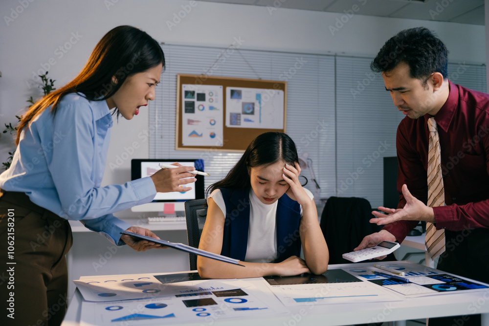 Two angry colleagues are scolding a stressed businesswoman sitting at ...