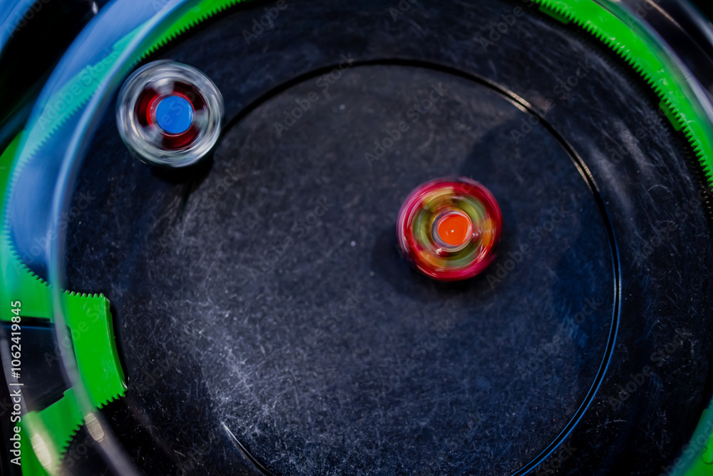 Beyblade battle of spinning toys in a fight of a Japanese origin game ...