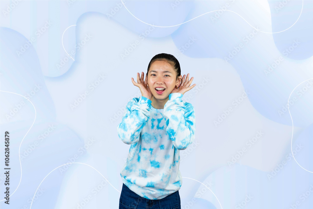 Yougn Asian girl with blue dress points and gives various expression ...